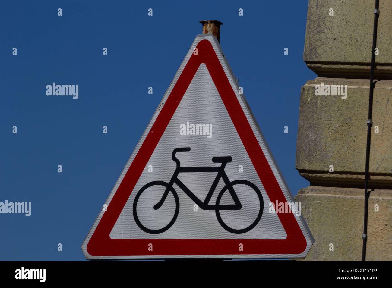 Cycle route ahead warning sign with a blue sky Stock Photo - Alamy