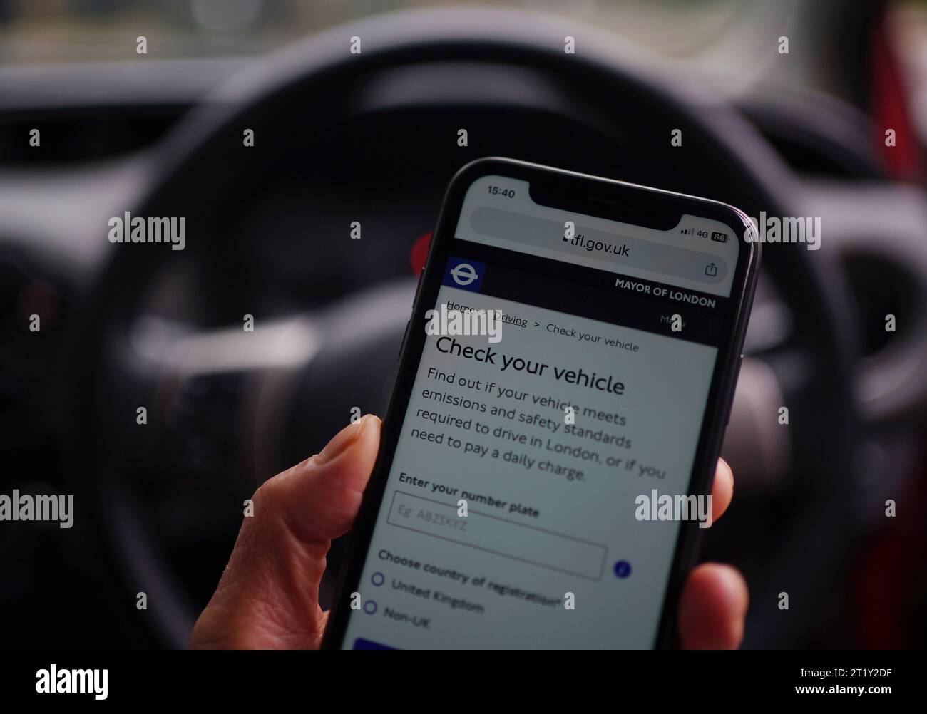 File photo dated 29/08/23 of a person checks their mobile phone whilst ...