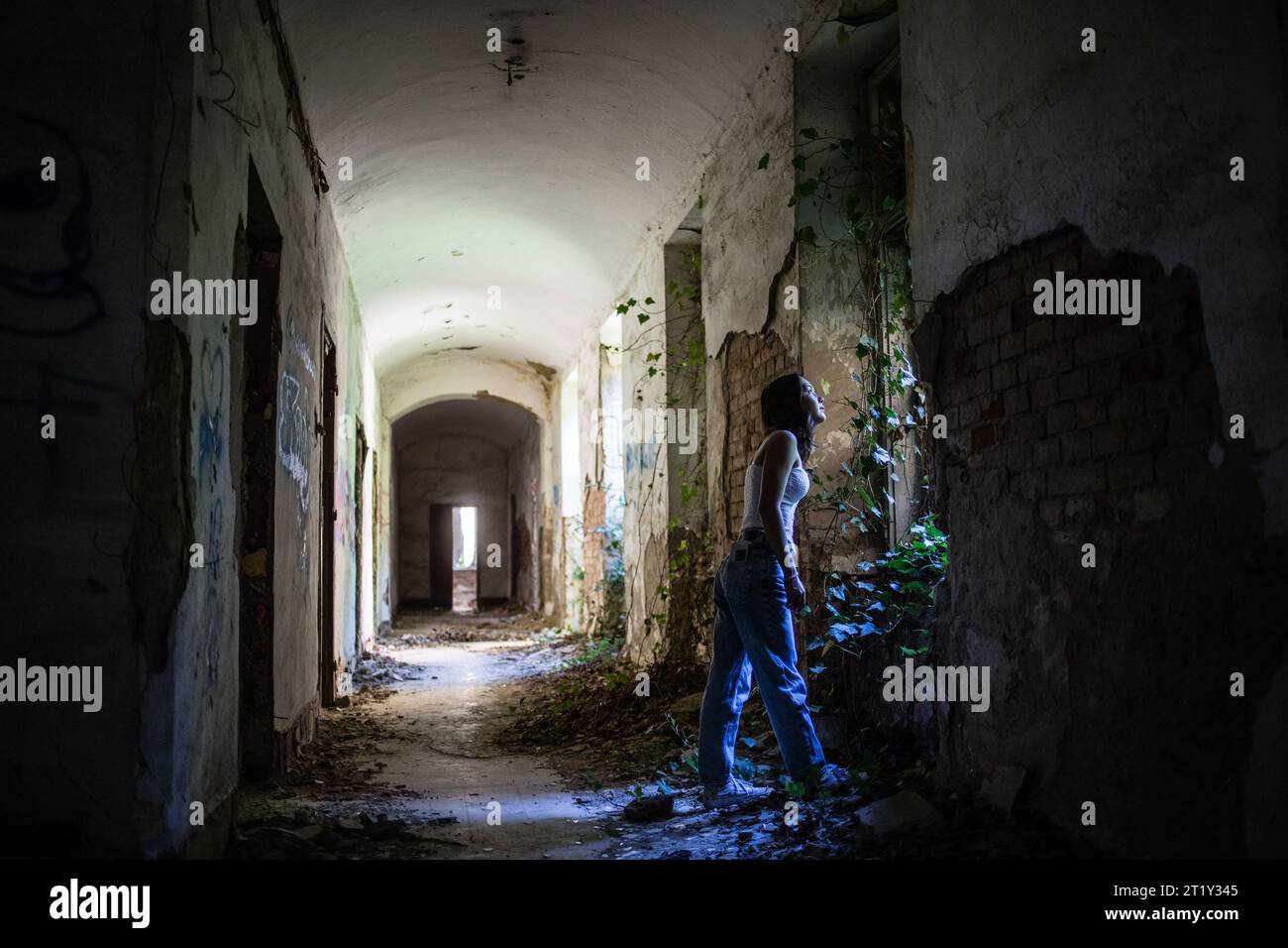 A female model poses inside the ruins of a Soviet-era military base in ...
