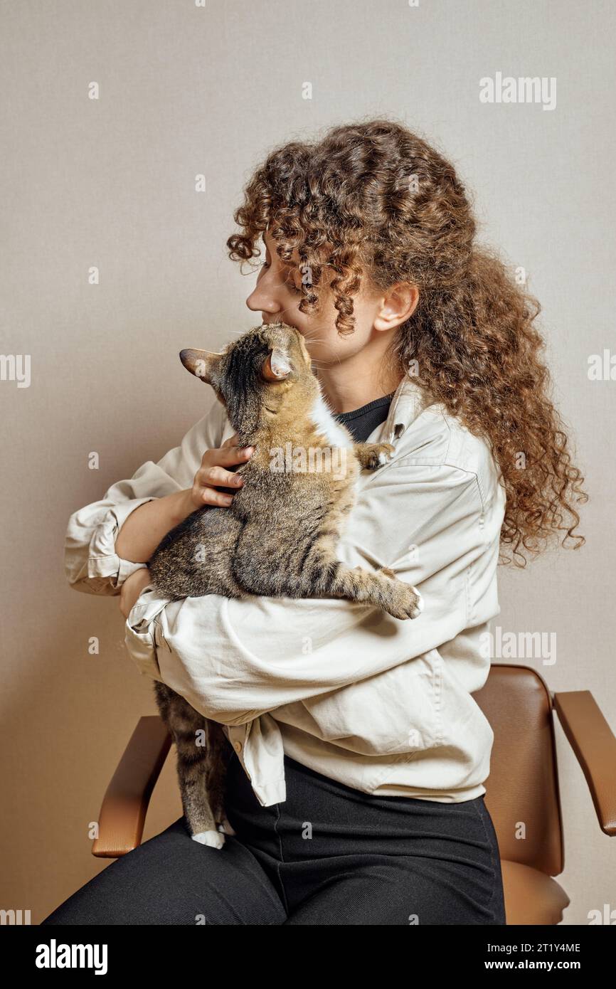 Tabby cat kisses his cute owner Stock Photo - Alamy