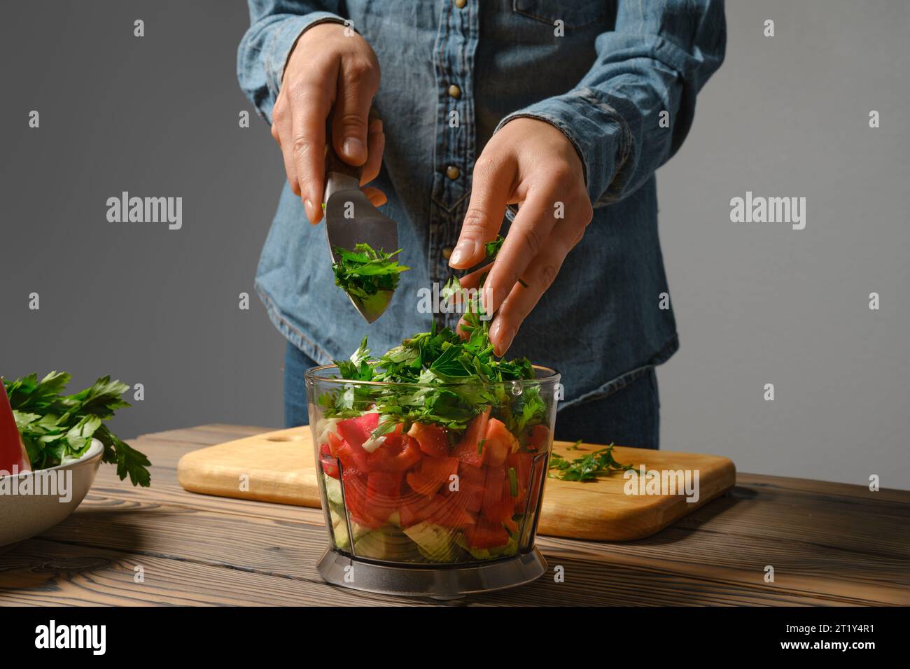 Close up hands dropping chopped hi-res stock photography and images - Alamy