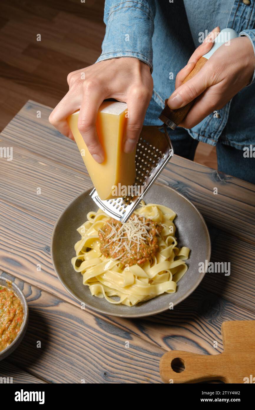 Grating cheese hi-res stock photography and images - Alamy