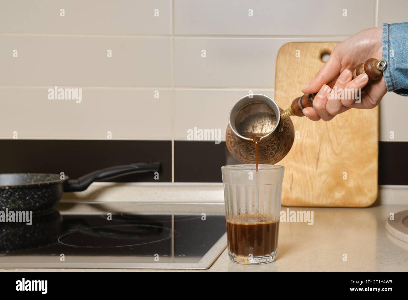 Woman pouring black coffee from hi-res stock photography and images - Alamy