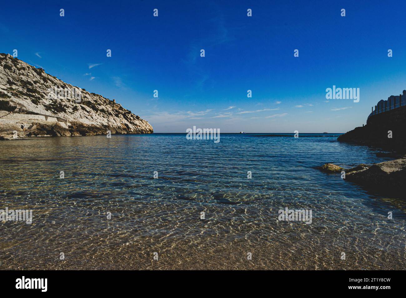 Calm Beach Blue Sky and trasnparent water Stock Photo - Alamy