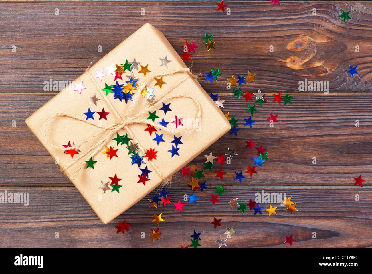 gift box with star shape decor on white wood table background Stock ...