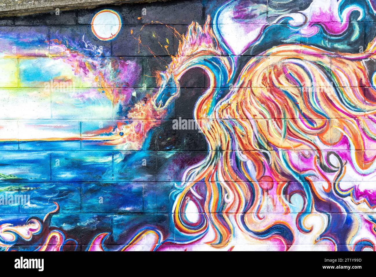 Seafront graffiti on a seawall at Herne Bay in the form of a highly ...