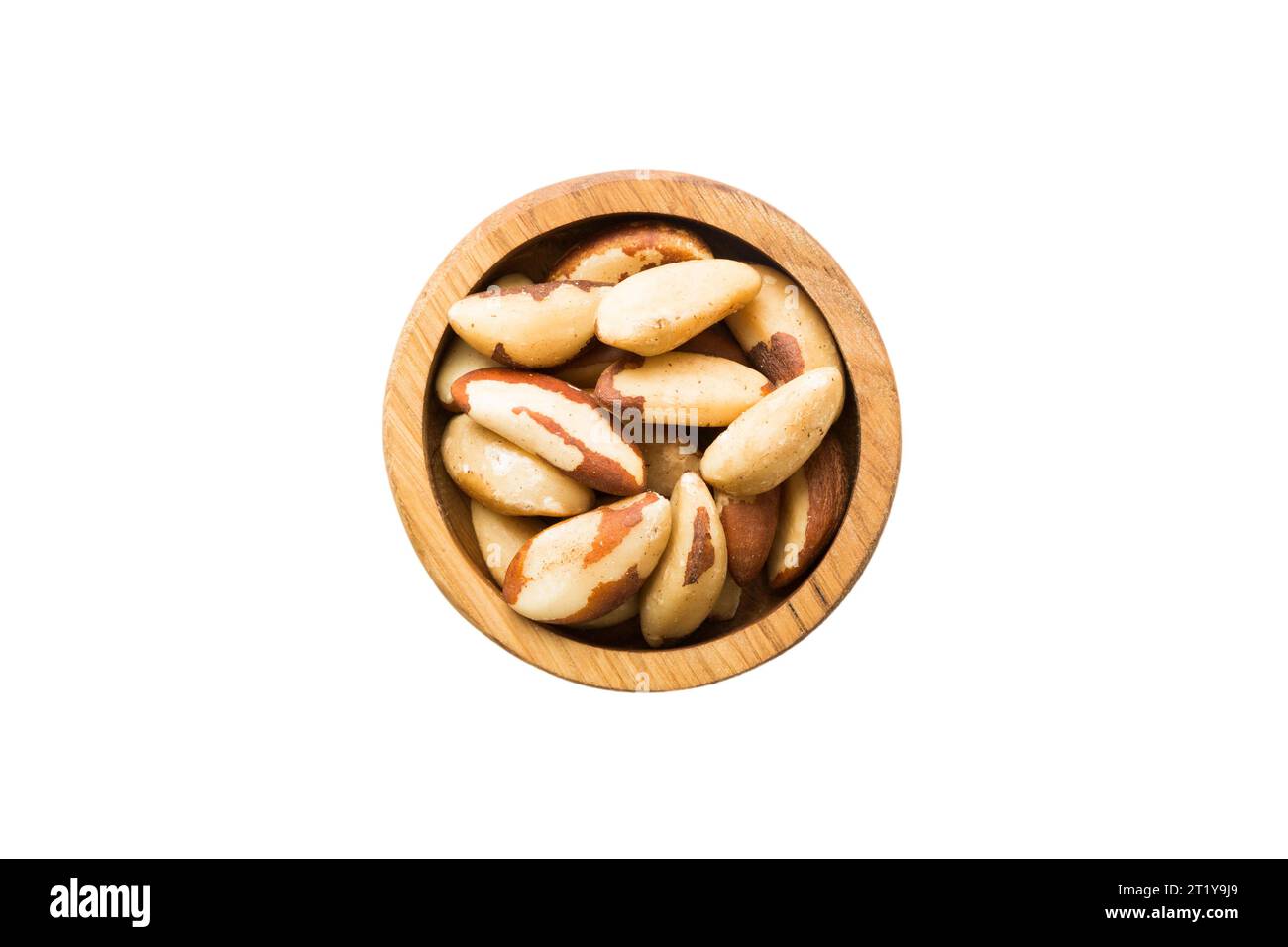 Roasted Brazil nut in bowl isolated on white background. Brazil nut is ...