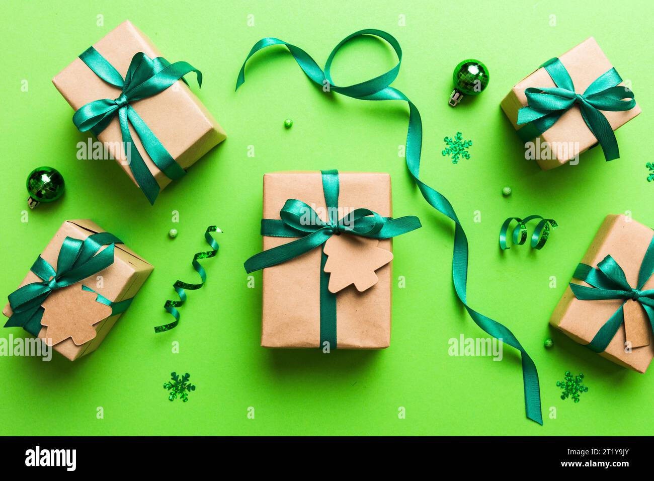 Christmas kraft gifts box with ribbon on colored background. Cozy ...