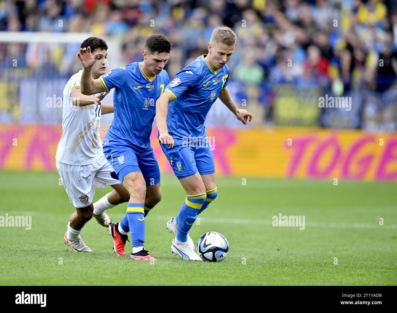 PRAGUE, CZECHIA - OCTOBER 14, 2023 - Players of Ukraine (blue kit) and ...