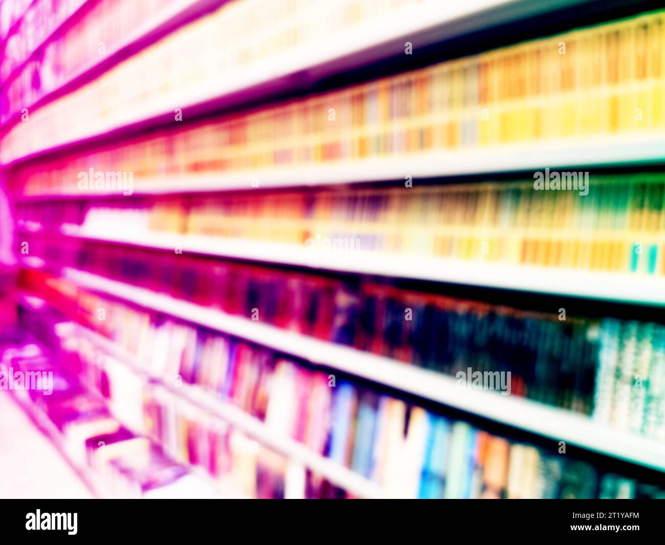Abstract blurred modern white bookshelves with books. Blur manuals and ...