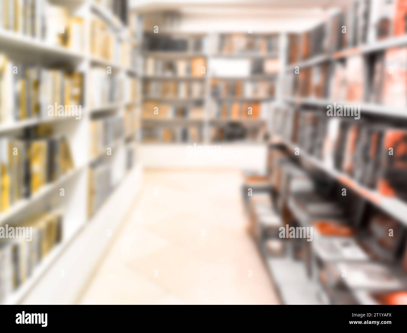 Abstract blurred modern white bookshelves with books. Blur manuals and ...