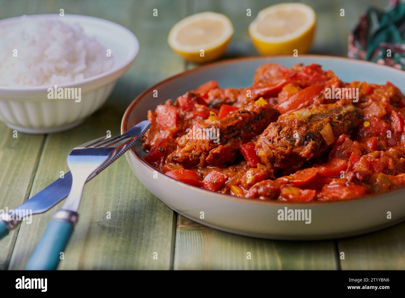Fish curry with white rice and lemon to garnish Stock Photo - Alamy