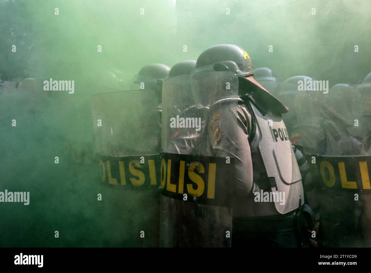 Police officers in Bogor City, Indonesia, wearing helmets and shields ...