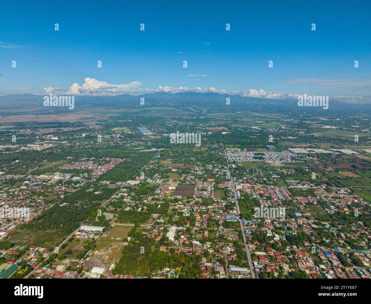 Colorful aerial view of modern city and blue sky and clouds. General ...