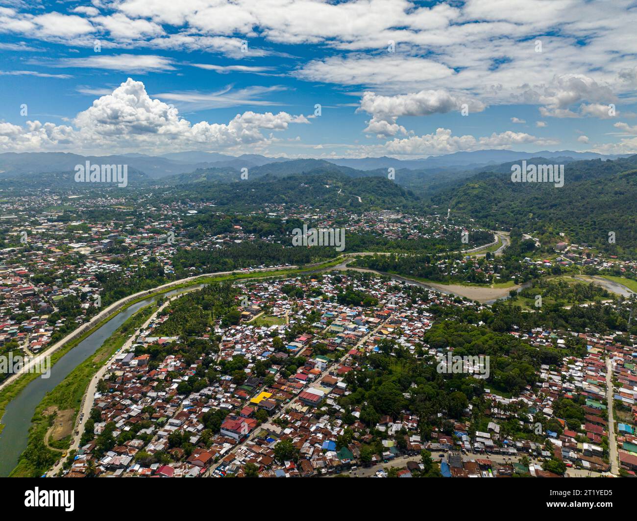 Iligan City with residential area and commercial building. Northern Mindanao, Philippines ...