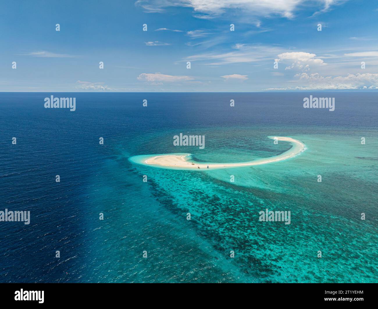 Sandbar wiith turquoise water and corals. Blue sea, blue sky and clouds ...
