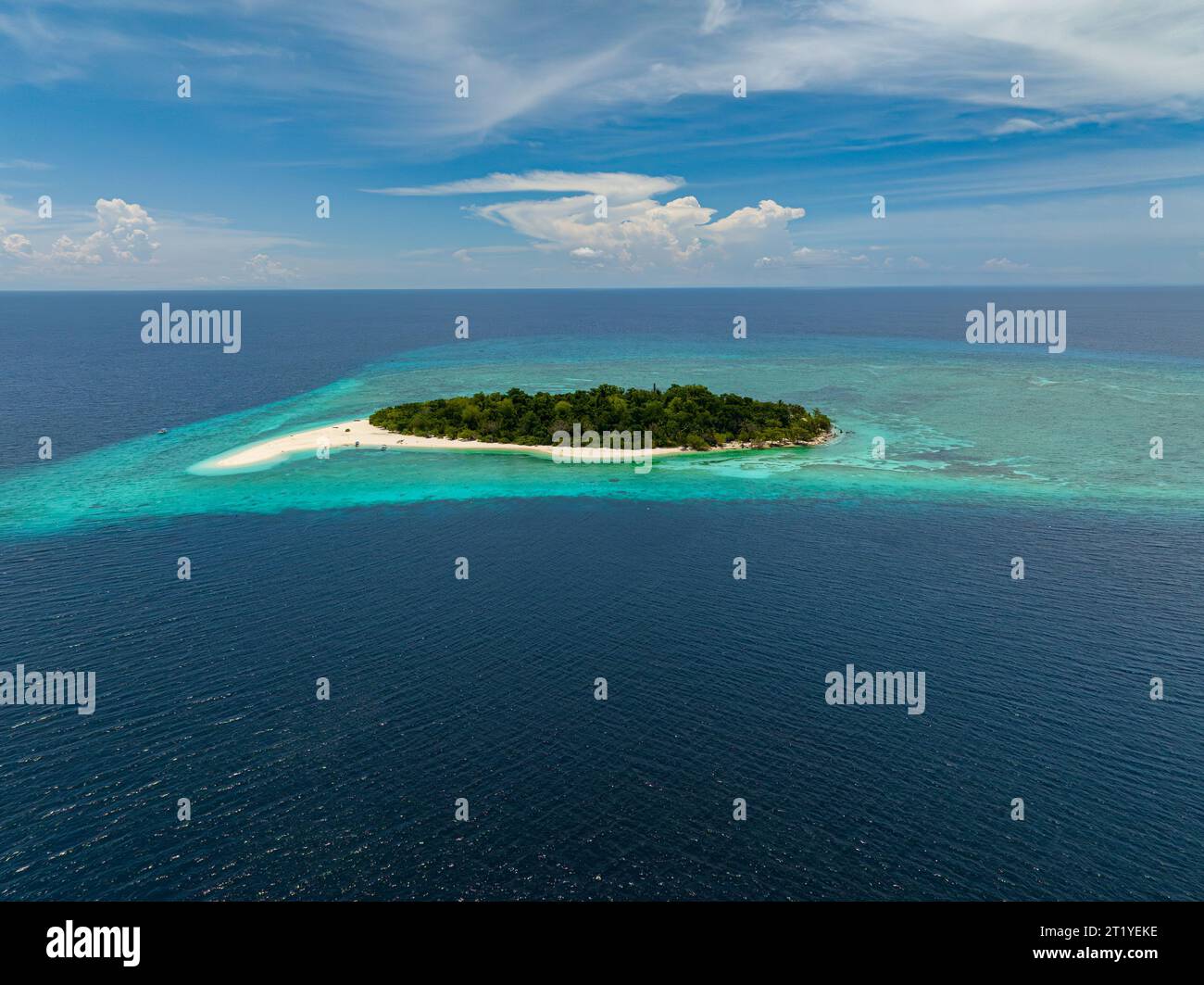 Small island with sand bar anf green trees. Mantigue Island with azure ...