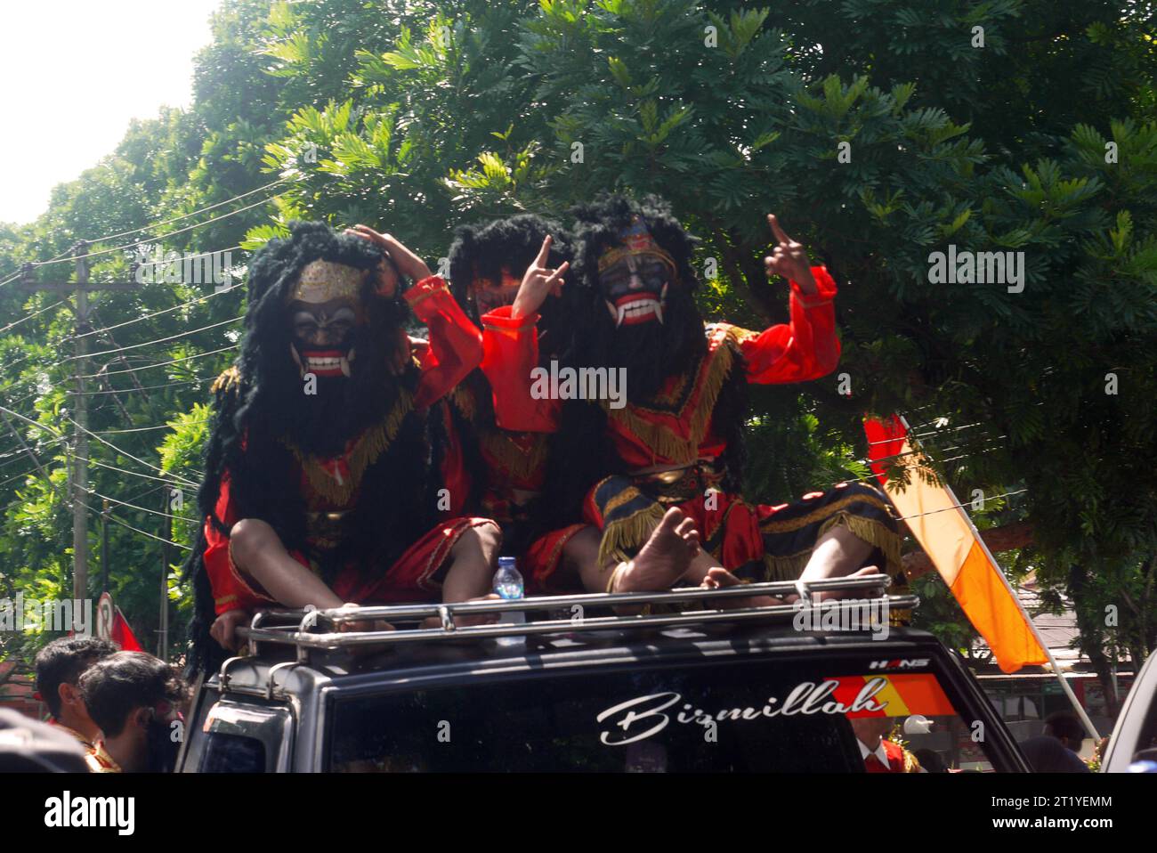 portrait of 3 men dressed up as giant, scary puppet characters with big ...