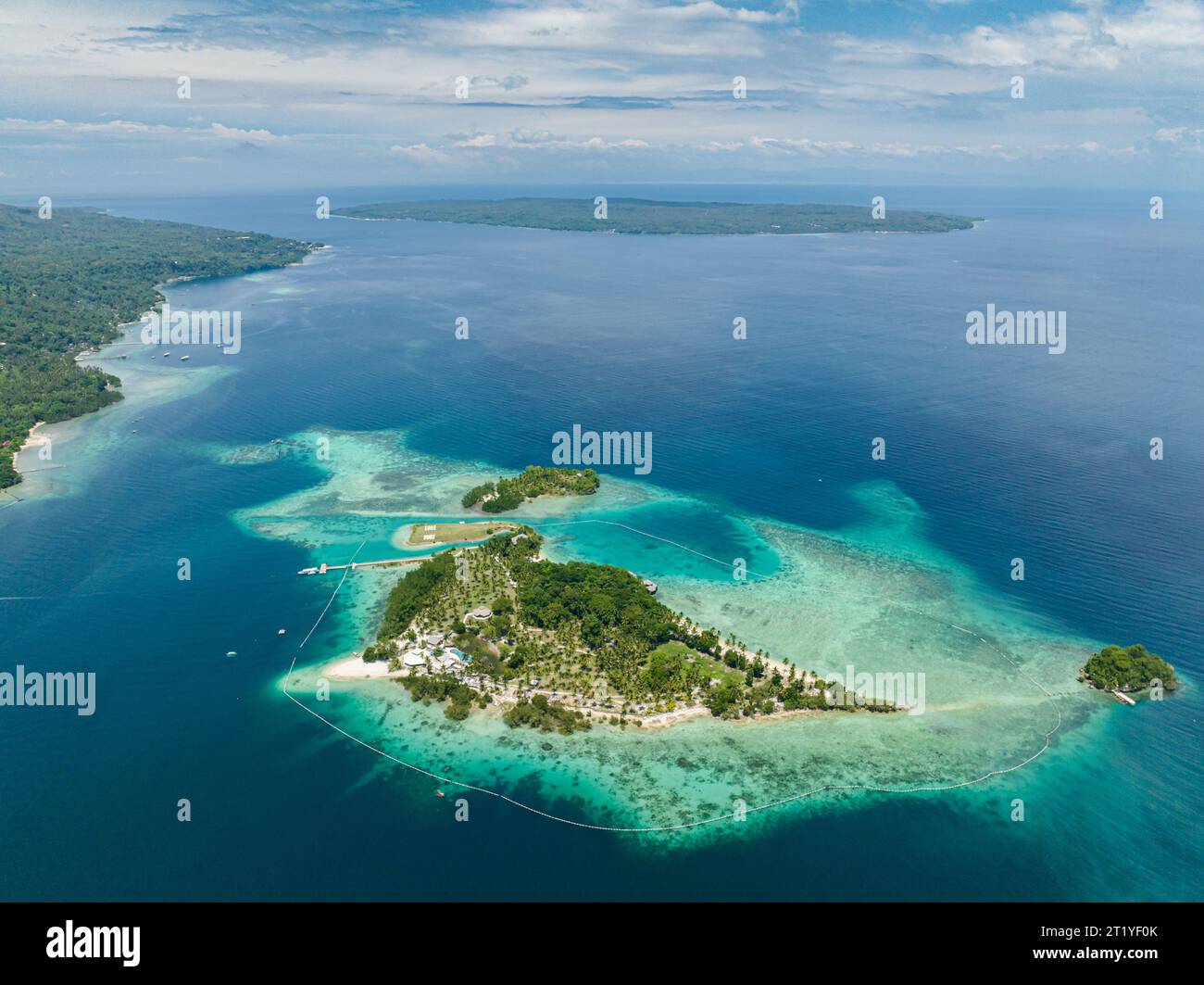 Tropical Island with sandy beach. Blue sky and clouds. Samal ...