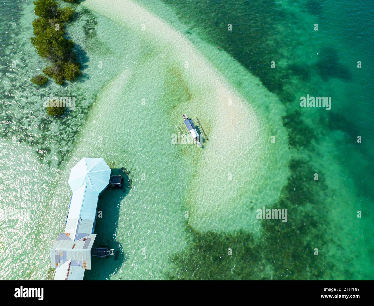 Transparent greenish water with boat and sandbar. Vanishing Island ...