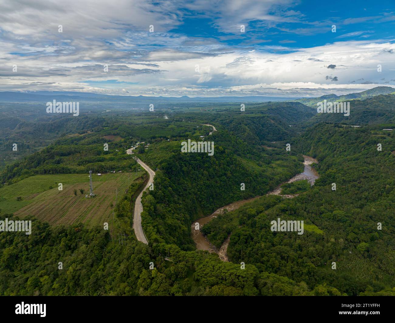 Mountain with rainforest and river in Mindanao. Blue sky and clouds ...