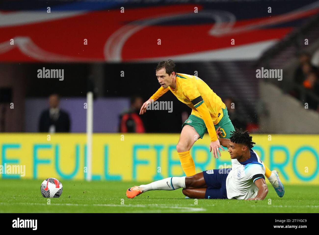 Ollie Watkins of England and Craig Goodwin of Australia - England v ...