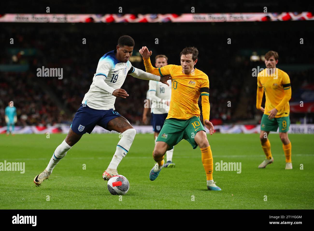 Marcus Rashford of England and Craig Goodwin of Australia - England v ...