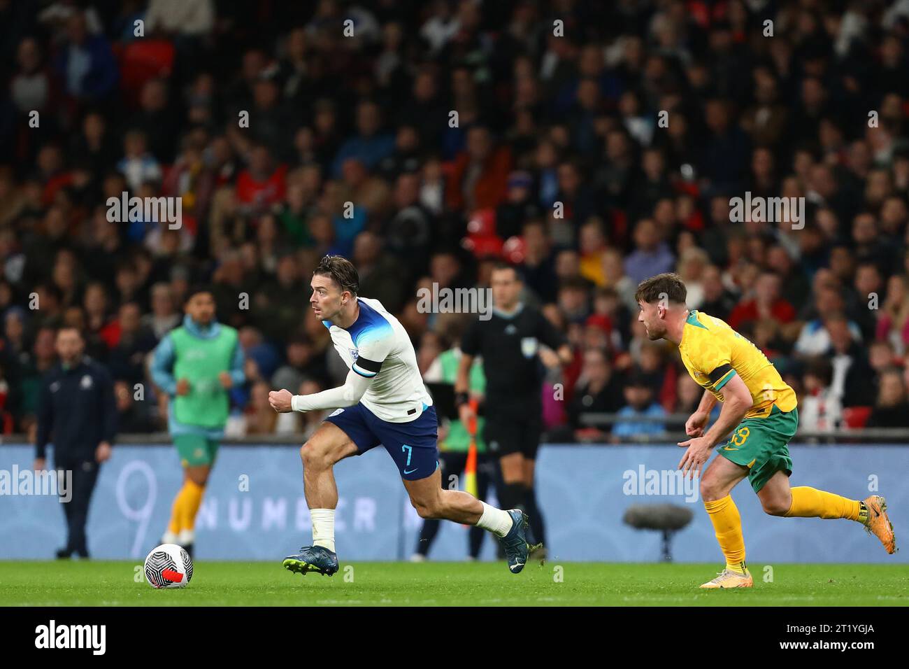 Jack Grealish of England and Ryan Strain of Australia - England v ...