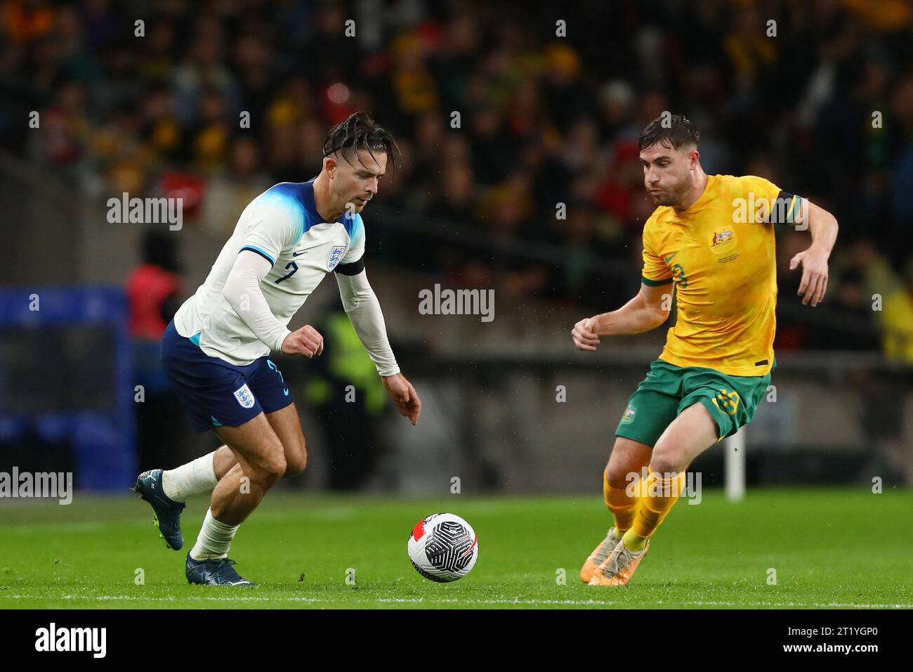 Jack Grealish of England and Ryan Strain of Australia - England v ...