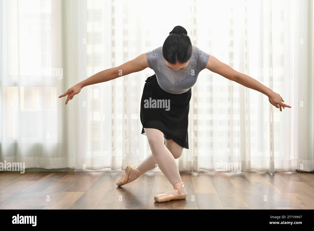 Pretty young ballerinas practicing ballet positions in studio. Dance ...