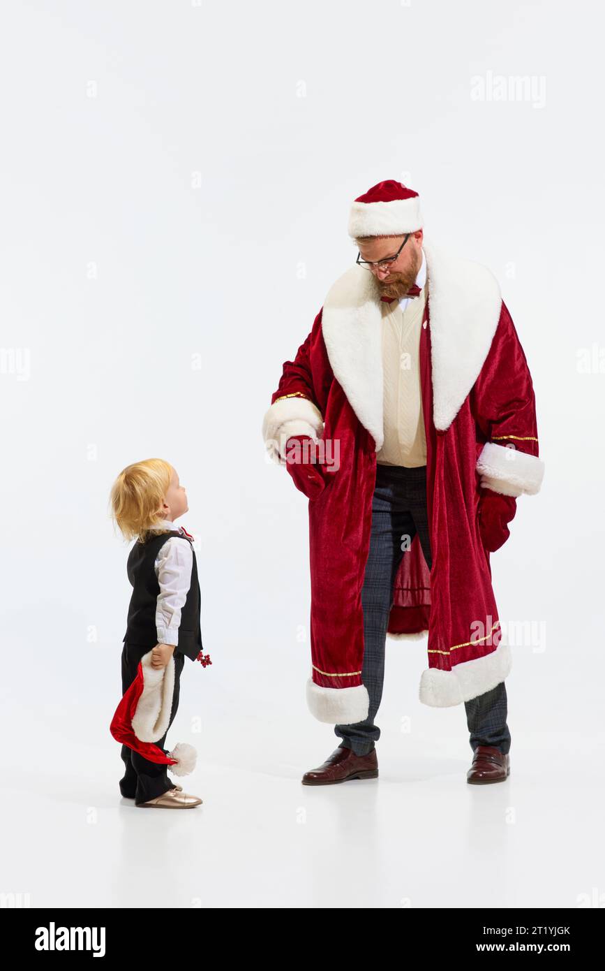 Ho-ho-ho. Merry Christmas. Father, man, looks like Santa Claus having ...