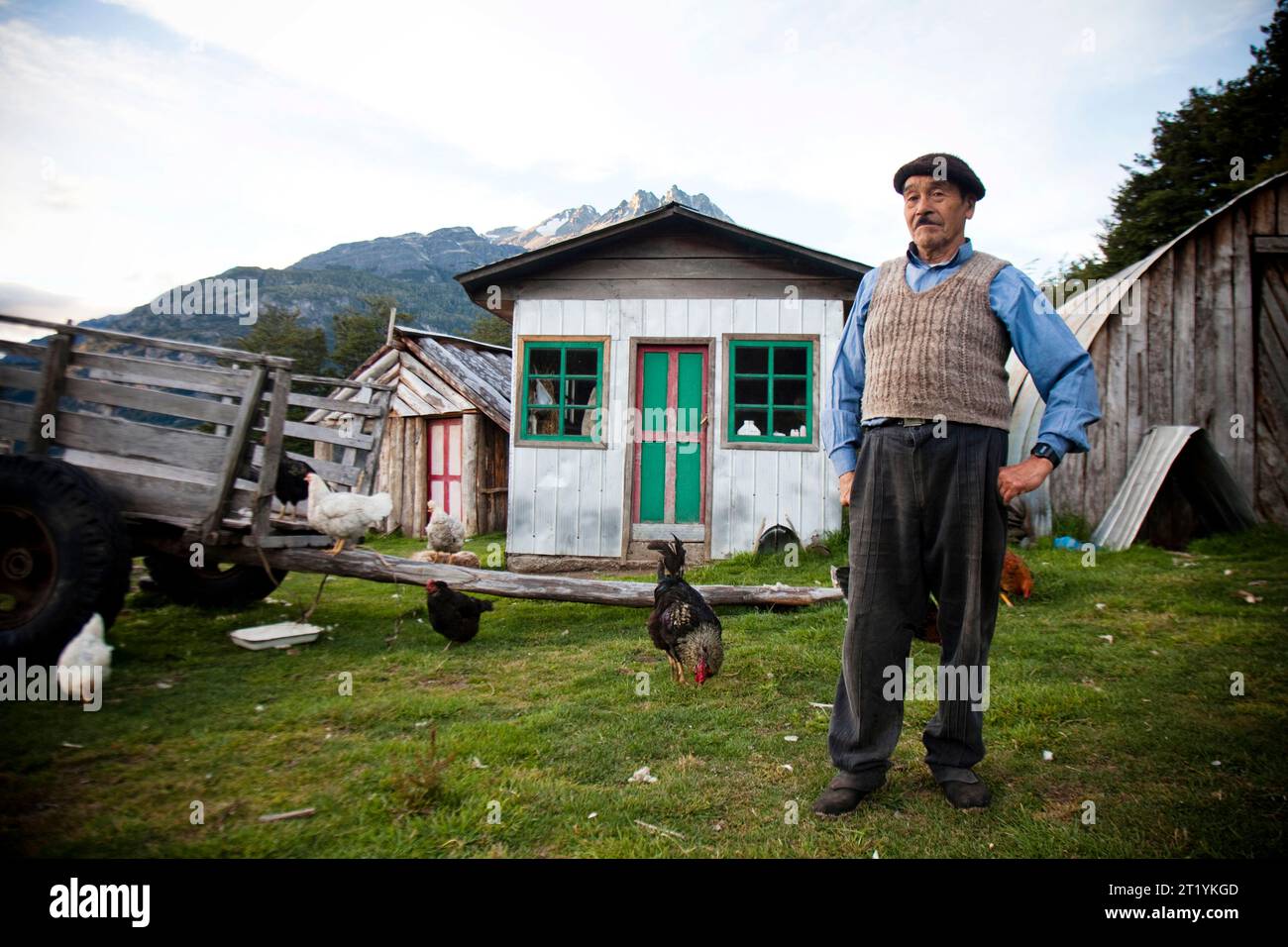 A portrait of an adult in front of his small, humble home Stock Photo ...