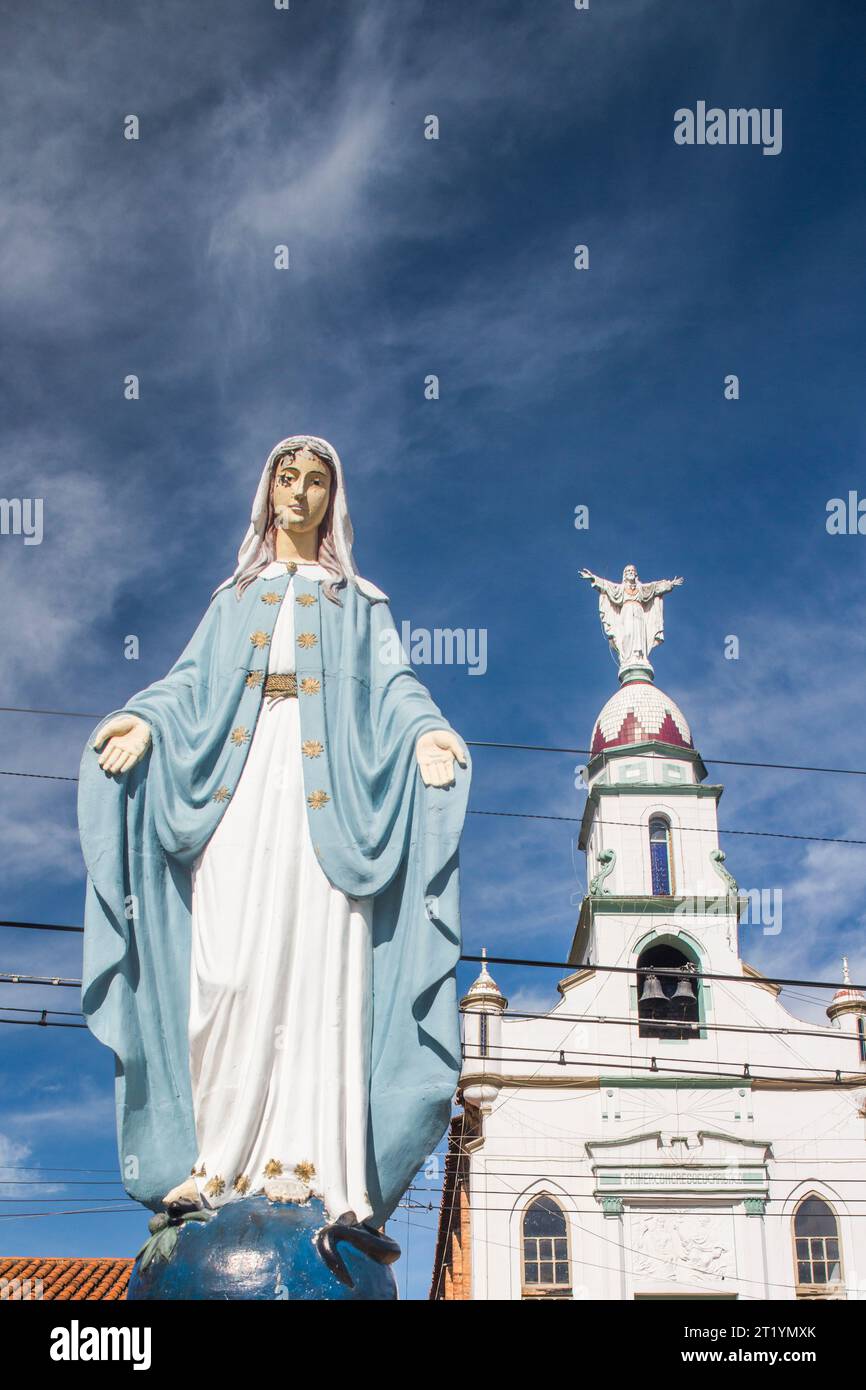 A church and a statue of Mary in the town of Zipaquira in Colombia ...