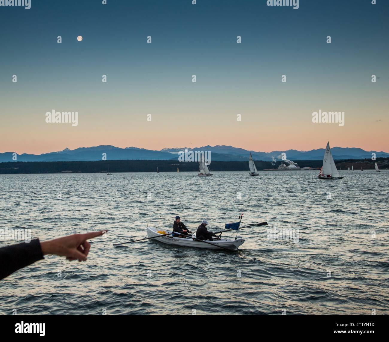 Two rowers row hard in the Strait of Juan de Fuca during the Race to ...