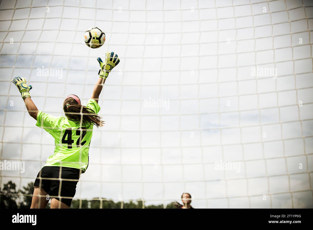 Goalie jumping hi-res stock photography and images - Alamy