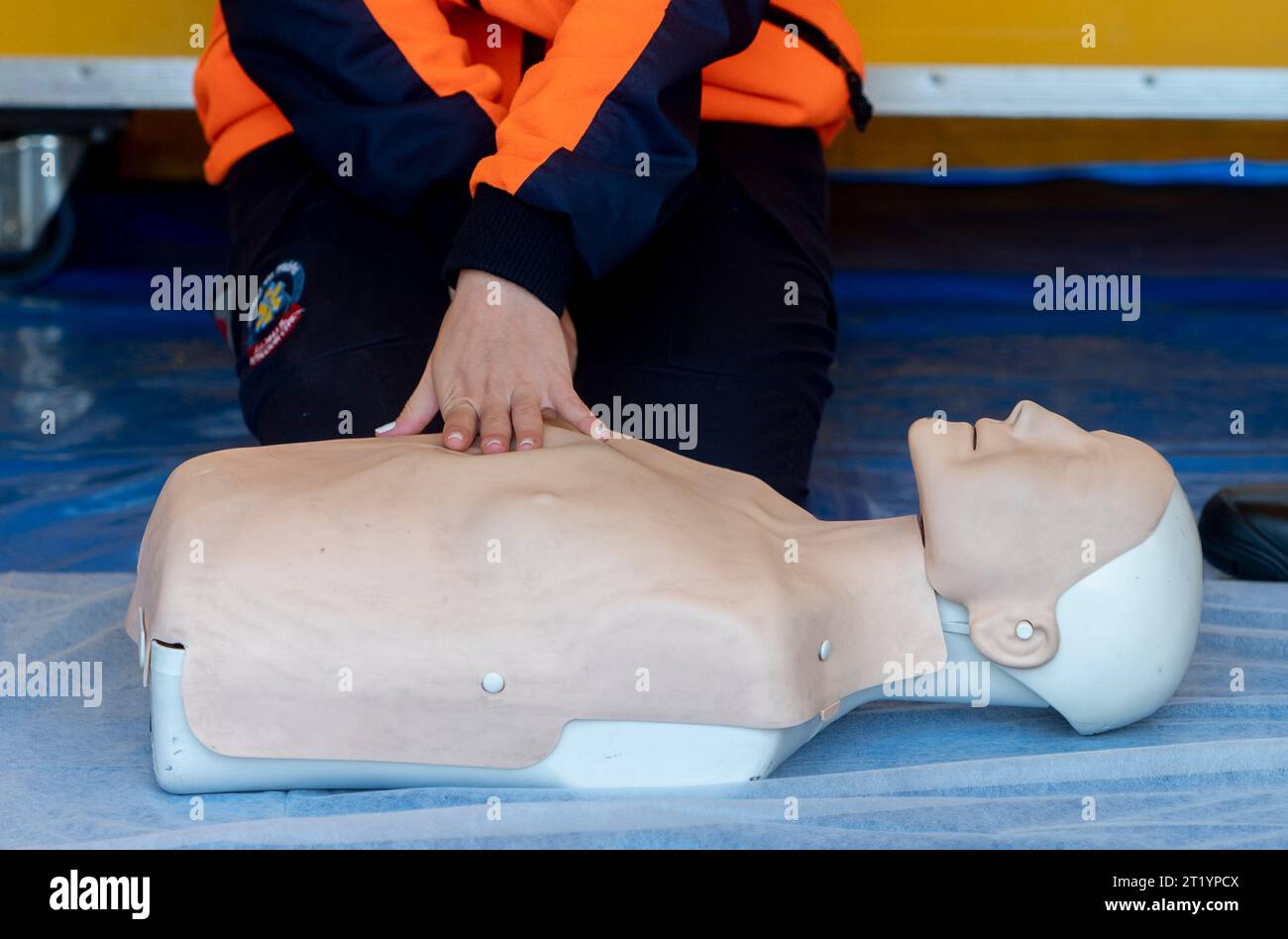 A health worker performs cardiopulmonary resuscitation techniques ...