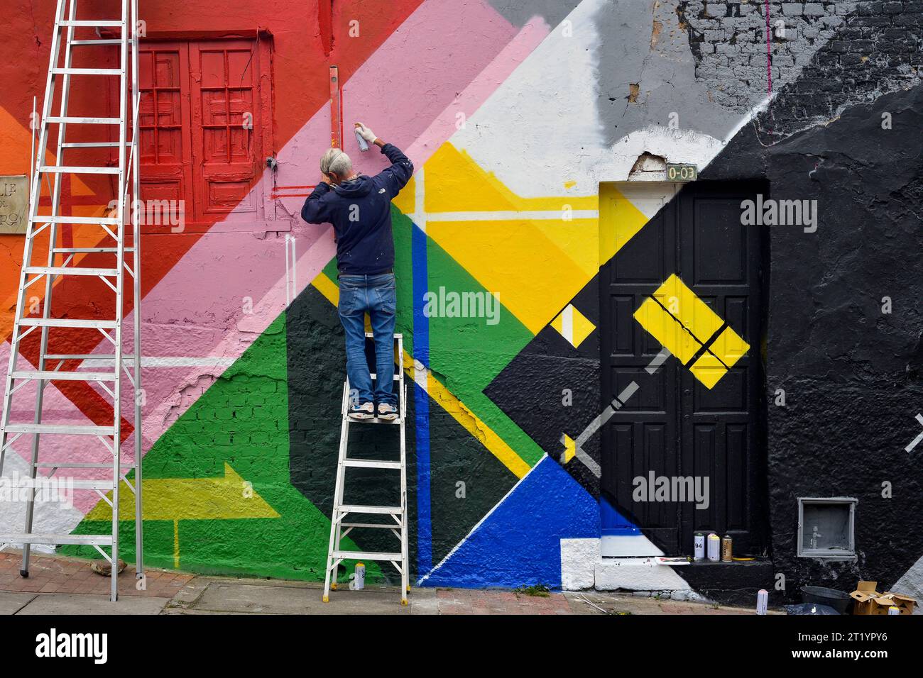 painting geometric shapes on the wall Stock Photo - Alamy