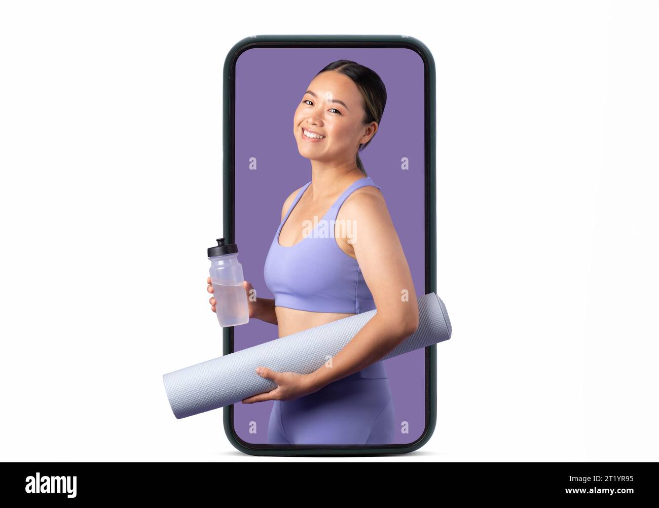 Happy asian woman with mat, bottle on phone screen over white studio ...