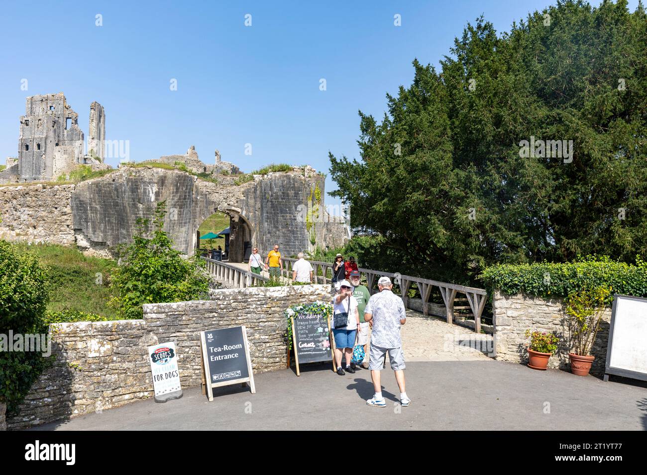 Corfe Castle in Devon England, visitors to the castle head towards the ...