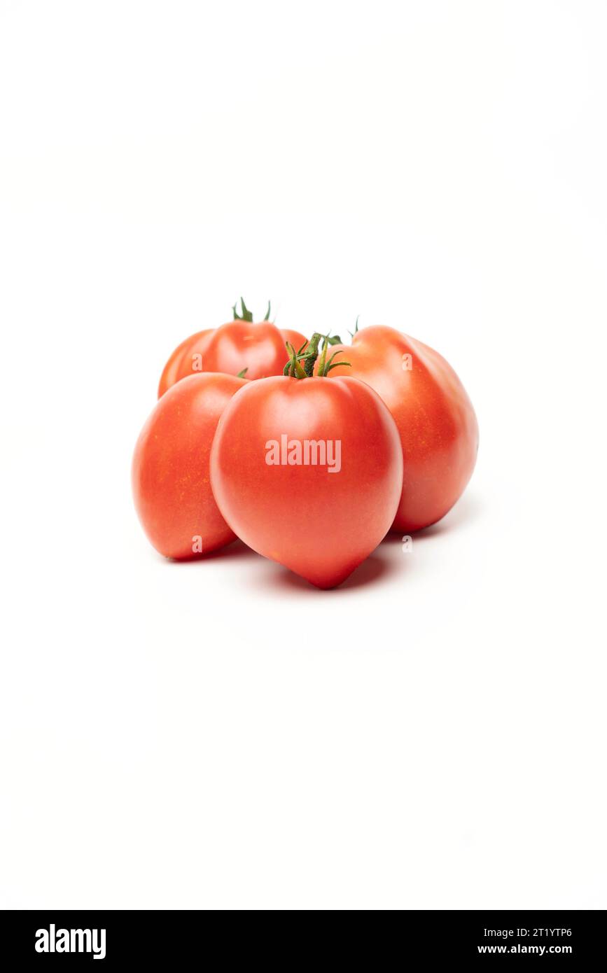 Fresh ripe tomatoes with a vibrant hue, clustered together, showcasing ...