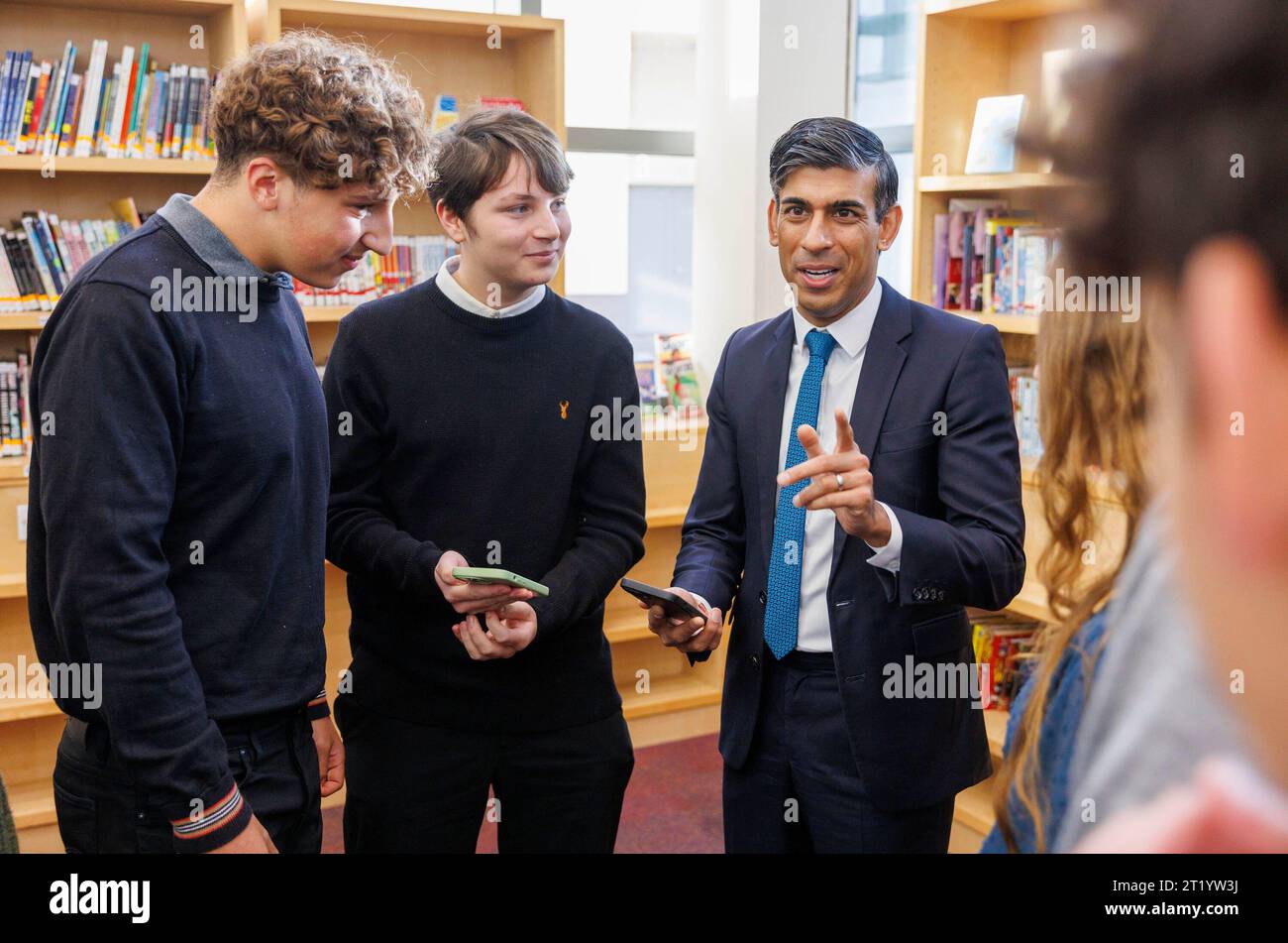 Britain's Prime Minister Rishi Sunak gestures while talking to 6th form ...