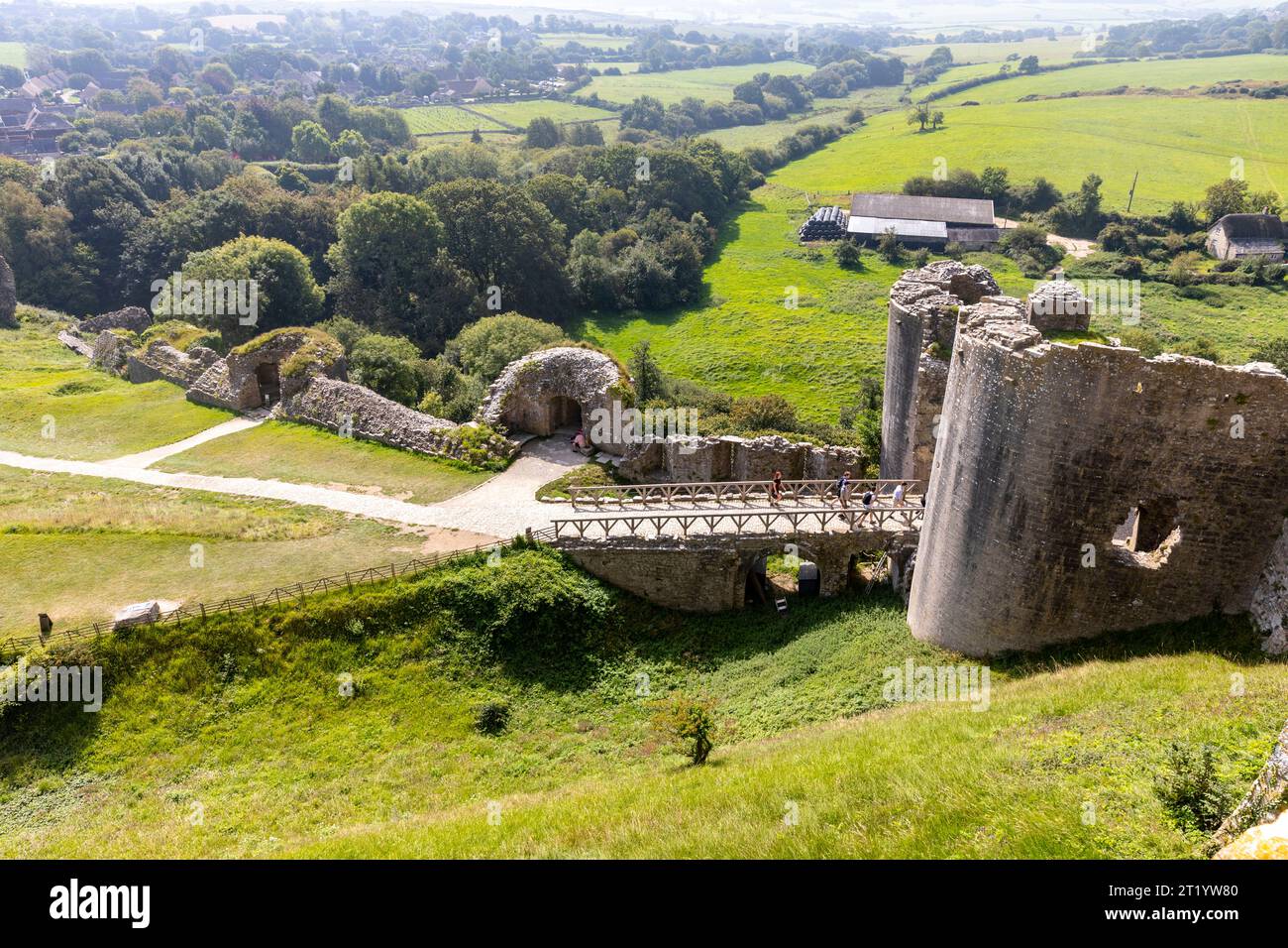 Corfe Castle aerial view of castle ruins and castle grounds on sunny ...