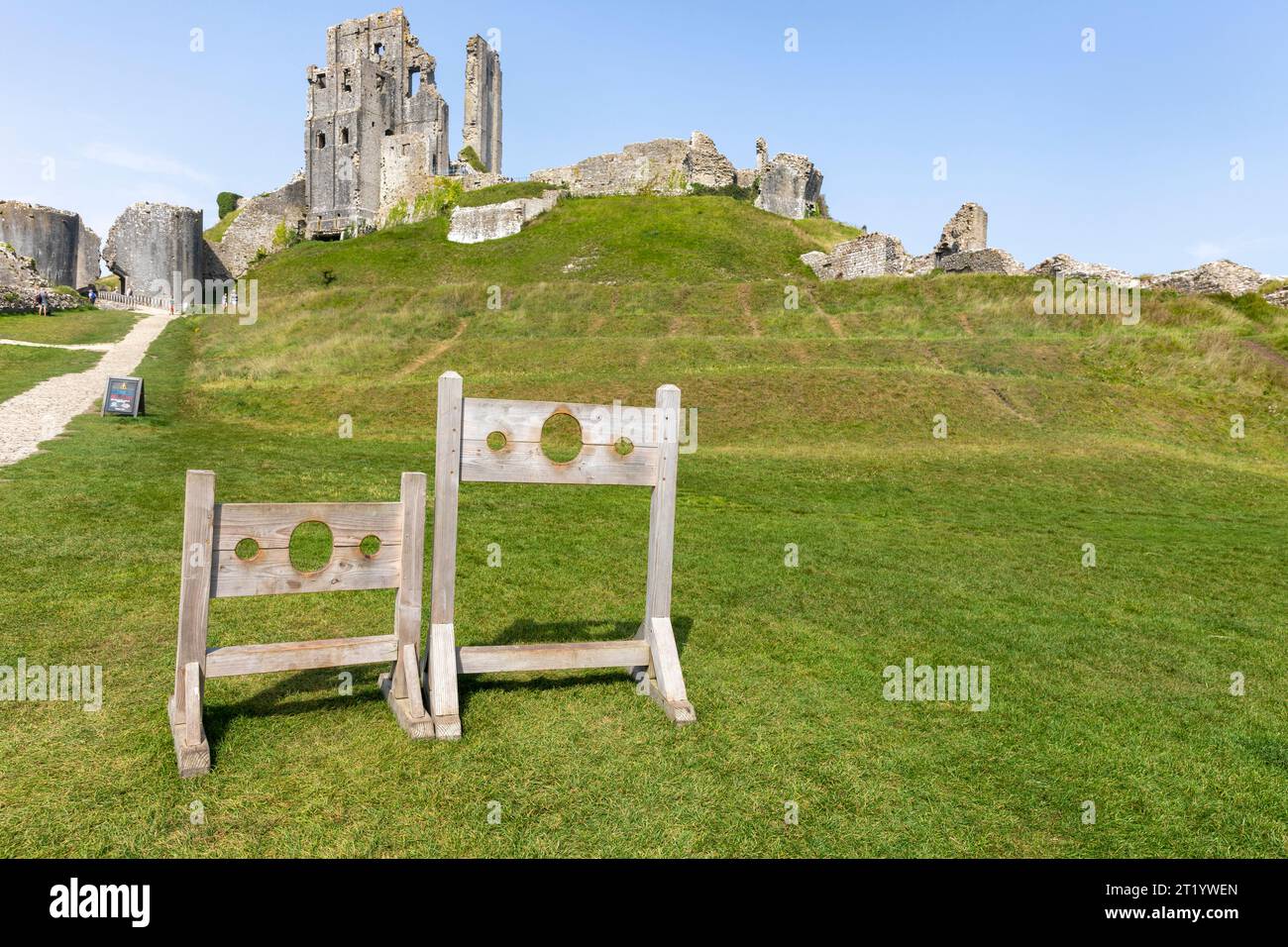Corfe Castle and the castle ruins, wooden stocks for head and hands ...