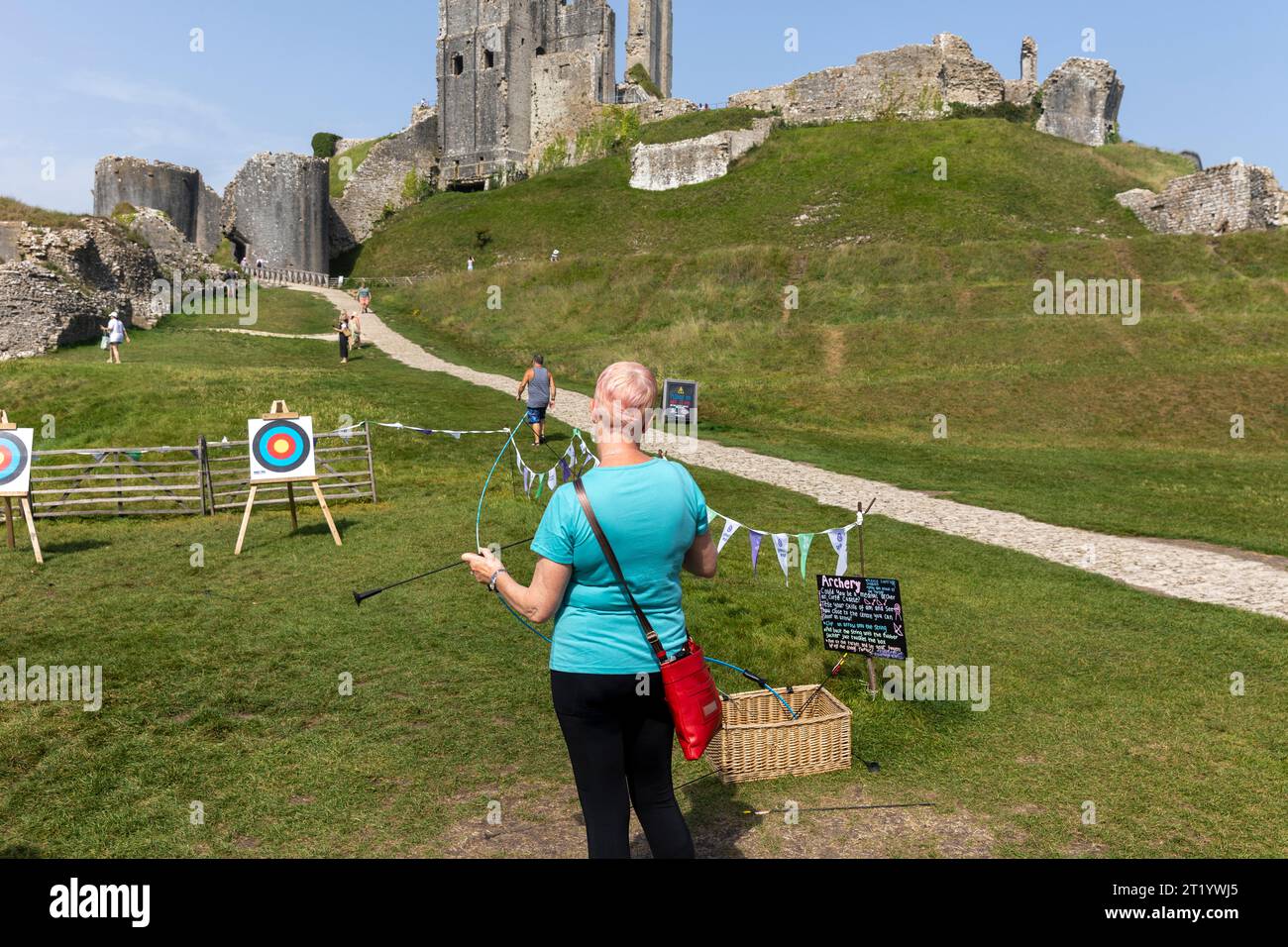 Corfe Castle Dorset, model released woman using bow and arrow at the ...