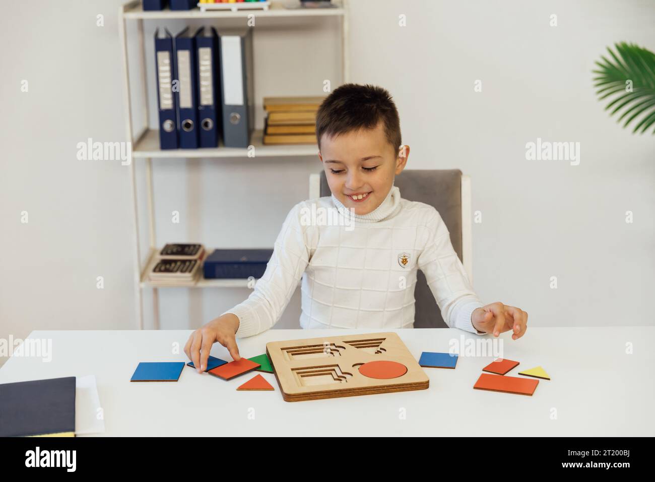 Cartoon happy boy playing table hi-res stock photography and images - Alamy