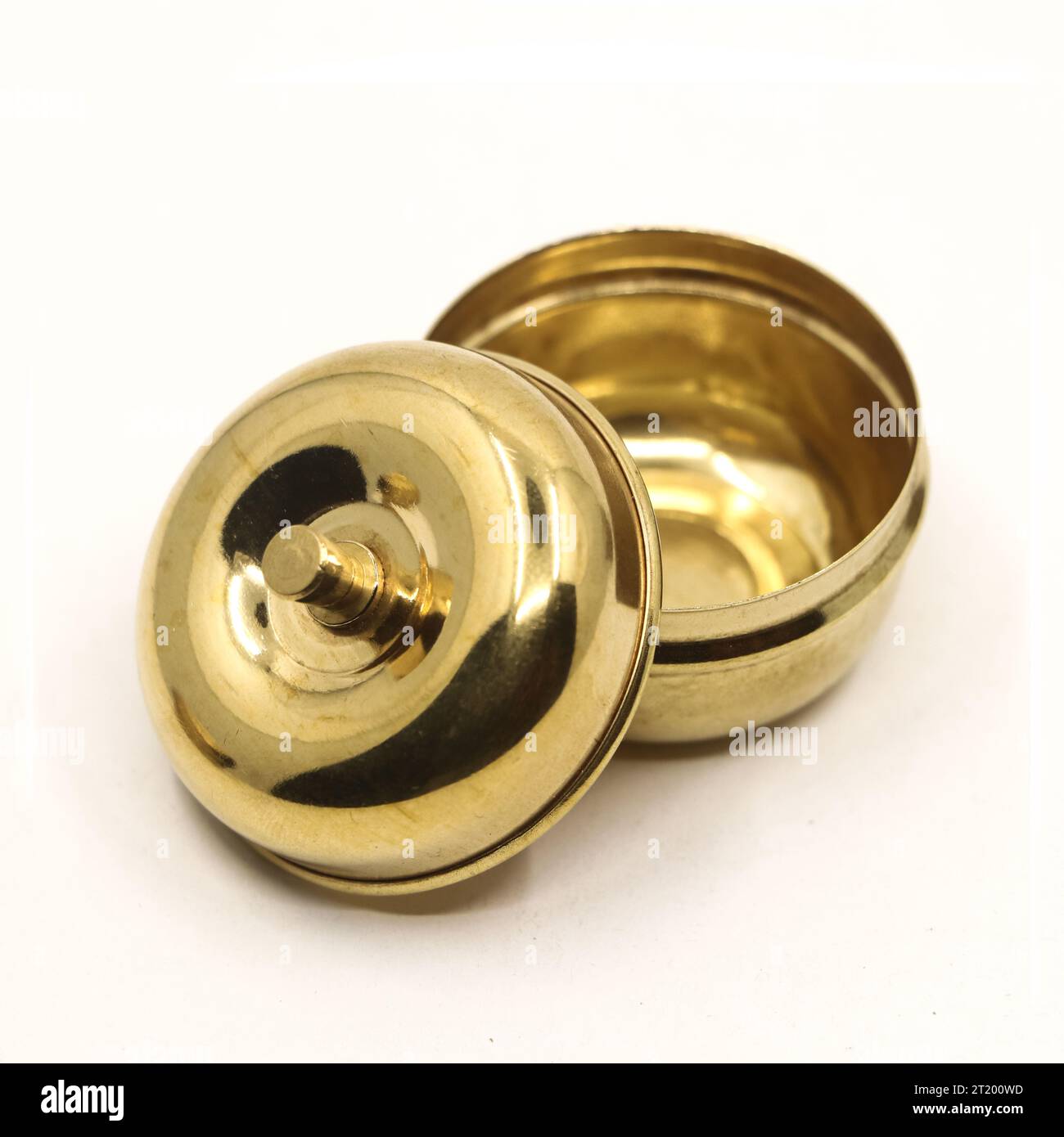 a traditional golden brass box bowl with lid used to store food spice ...