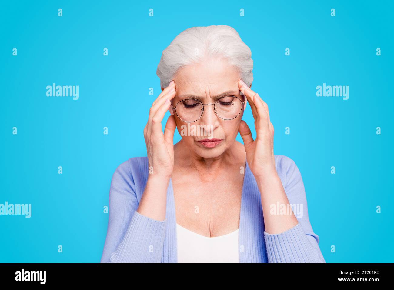 Gray haired old tired business woman wearing glasses, suffering from ...