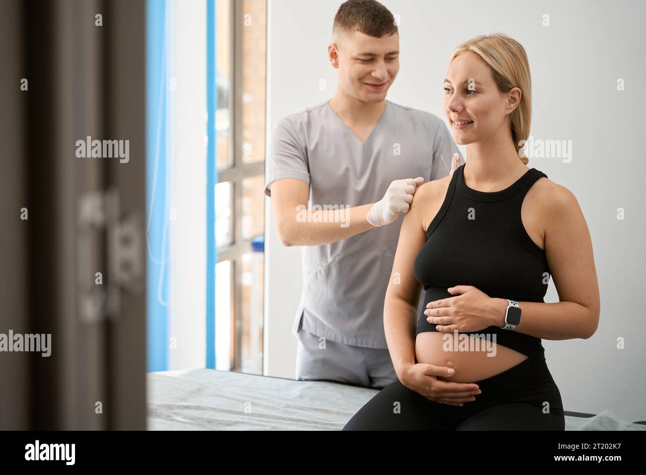 Specialist conducts an acupuncture session in a wellness center Stock ...