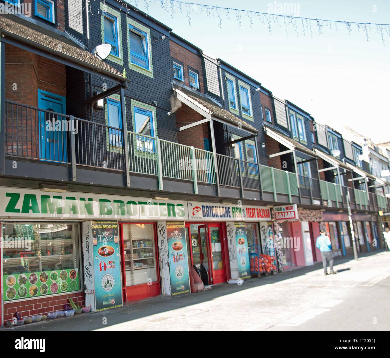 New homes built over shops, Brick Lane, Tower Hamlets, London, UK Stock ...