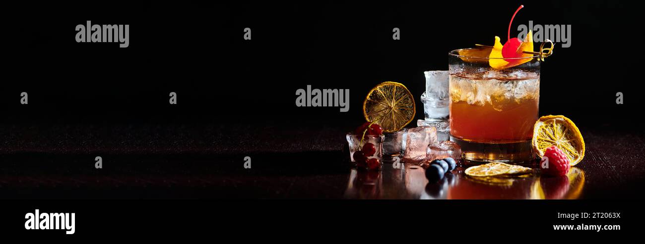 delicious refreshing negroni with fresh decorations on black background ...